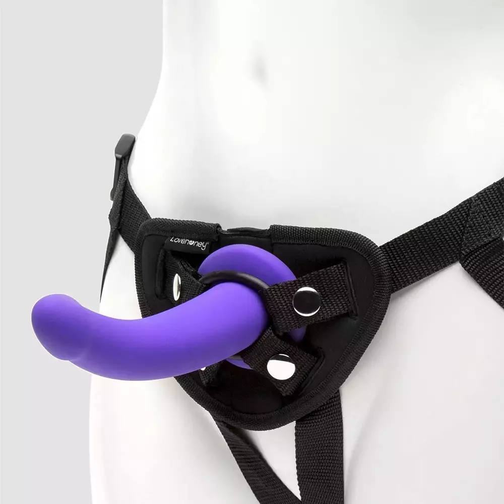 Cinta de vibrador roxo com arnês preto